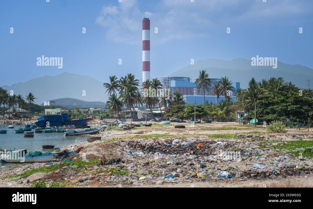 Spilled garbage on beach of big city. Empty used dirty plastic bottles ...