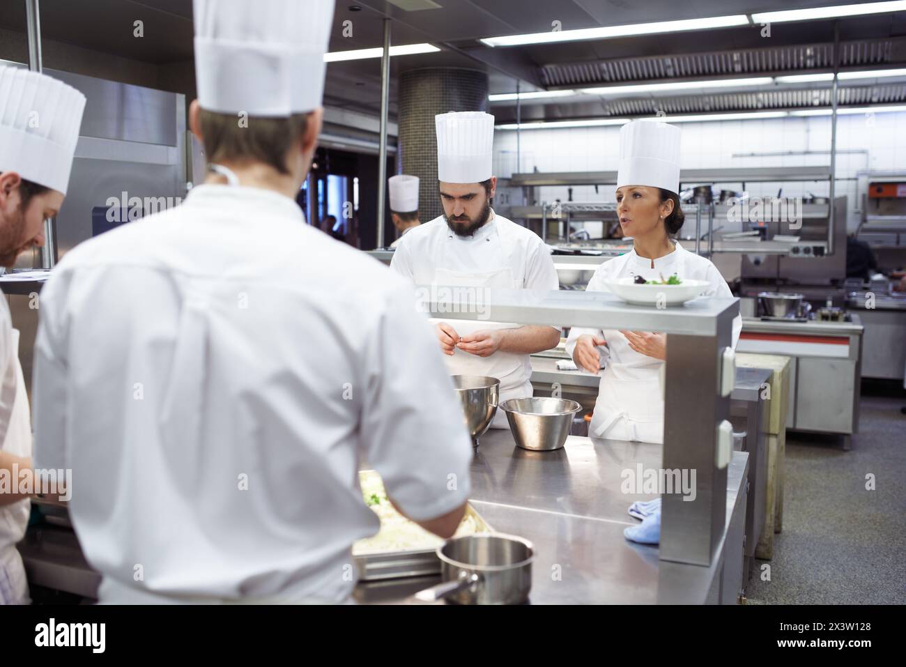 Chef, kitchen and hospitality with working and food prep for a ...