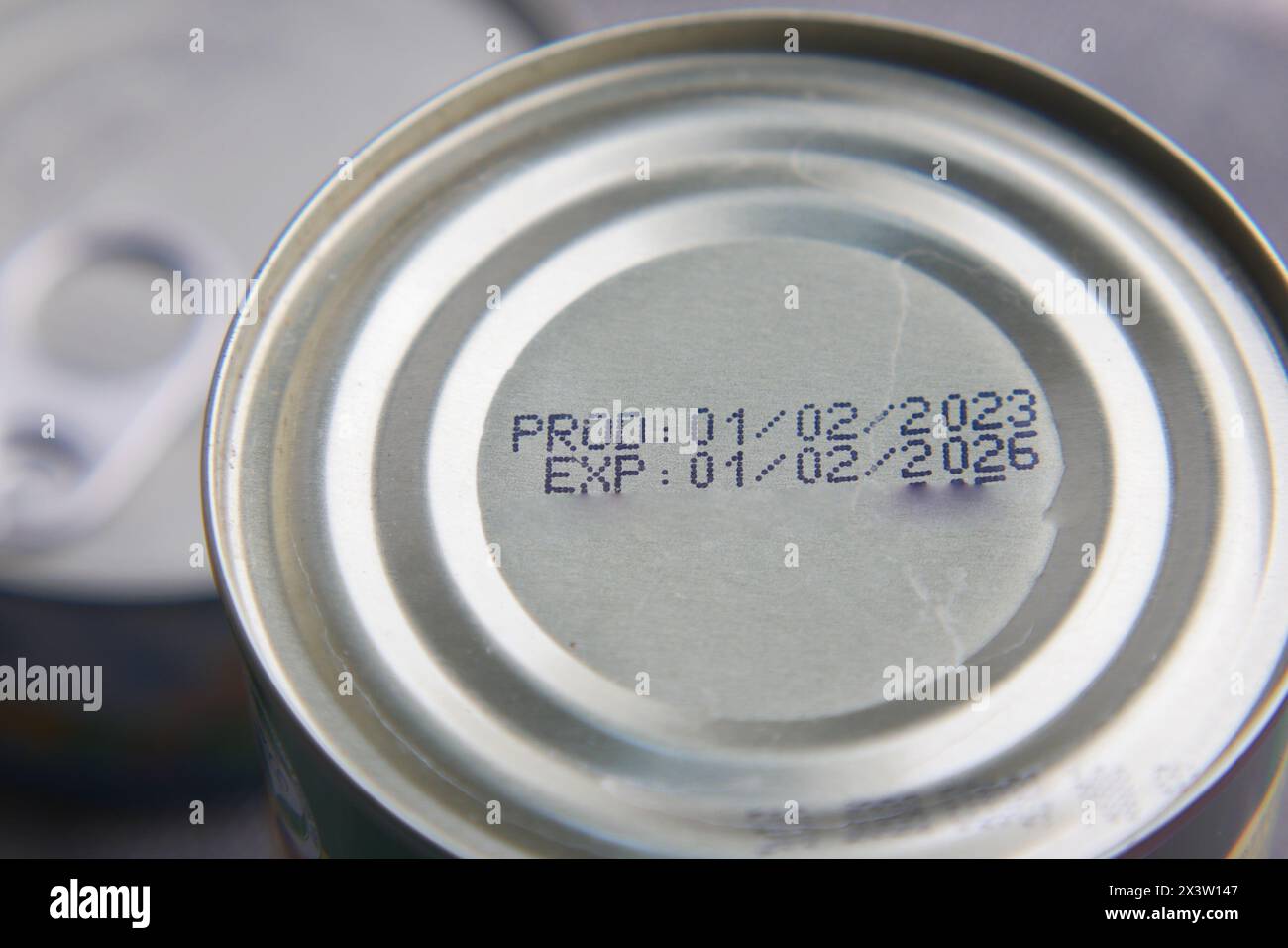 expire date on food can on white background Stock Photo - Alamy