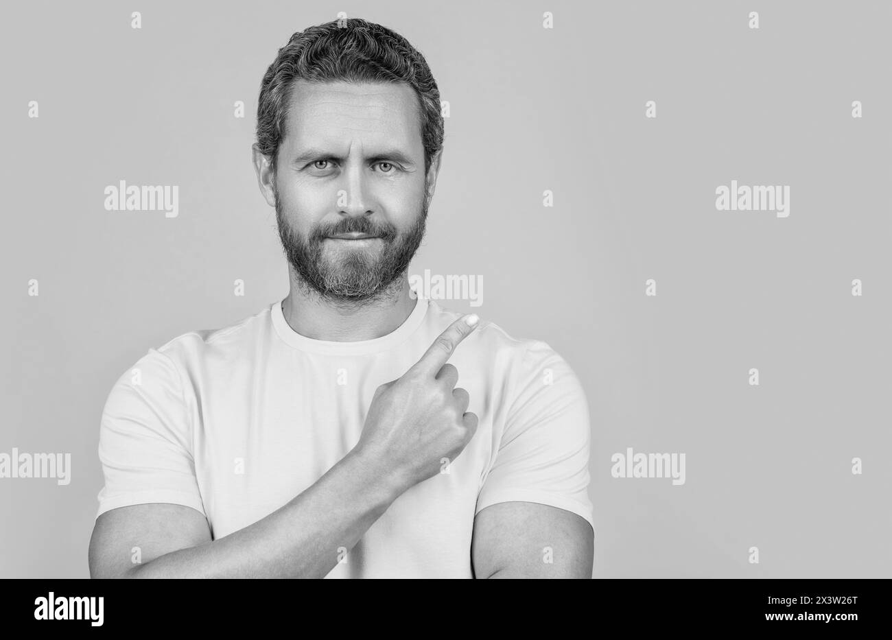 positive man pointing at advertisement offer isolated on yellow. man ...