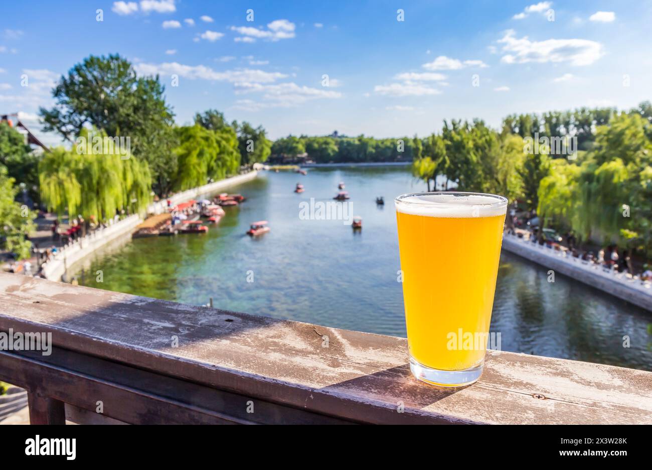 Glass of beer in the summer with Qianhai lake on the background in ...