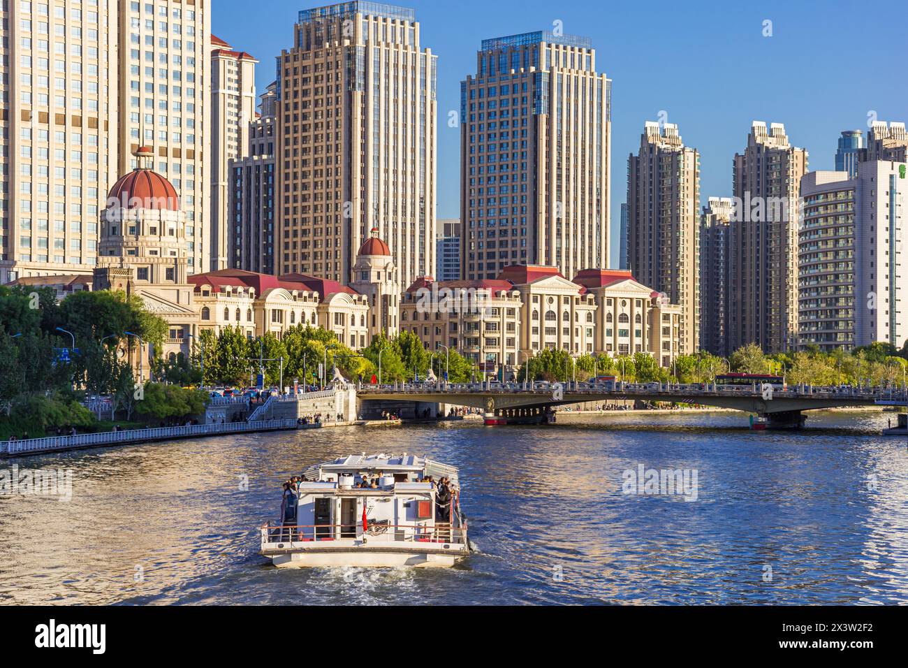 People enjoying a river cruise on the Hai river in Tianjin, China Stock ...