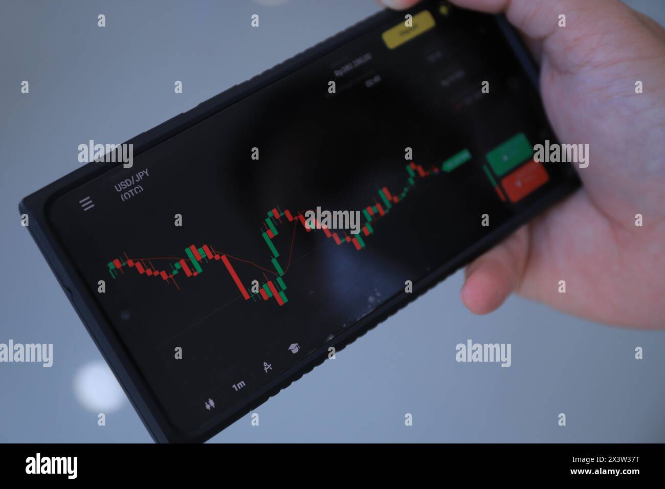 Trading on stock market with smartphone. Close up photo Stock Photo - Alamy