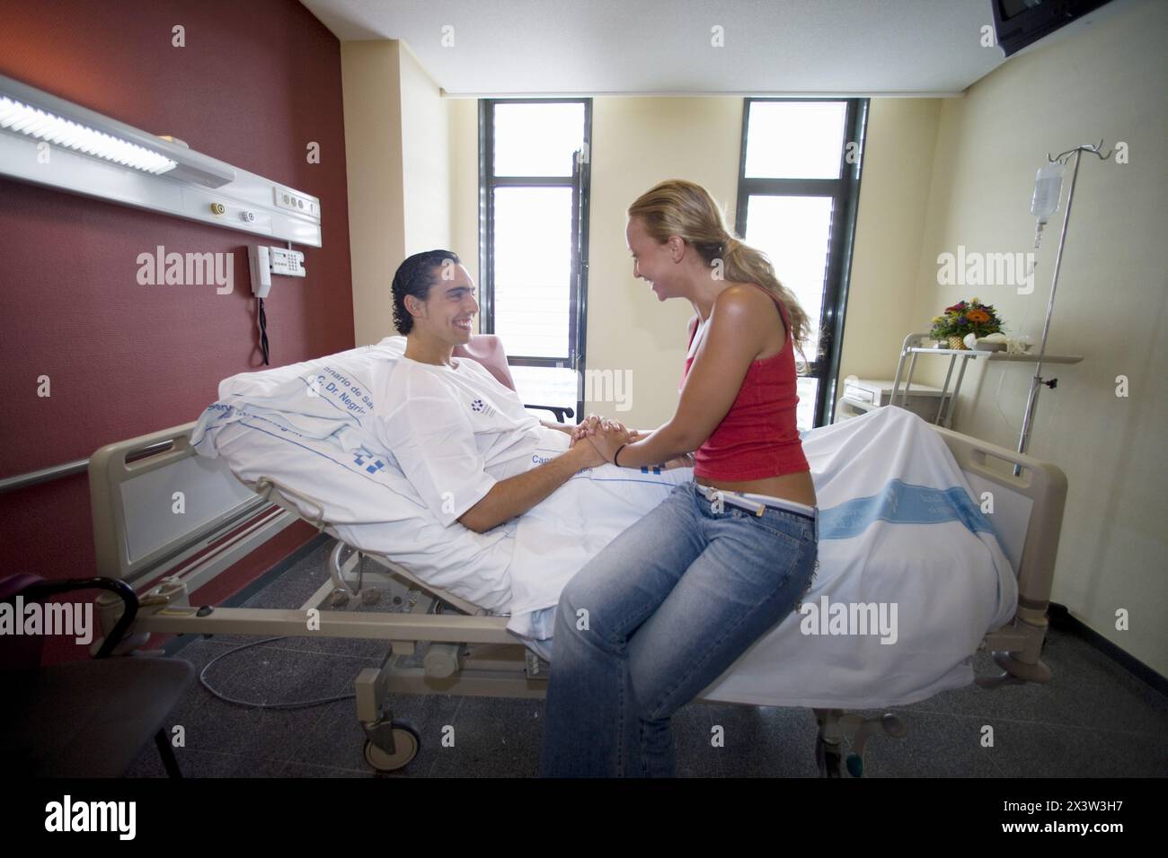 Hospital, family visit to patient Stock Photo - Alamy