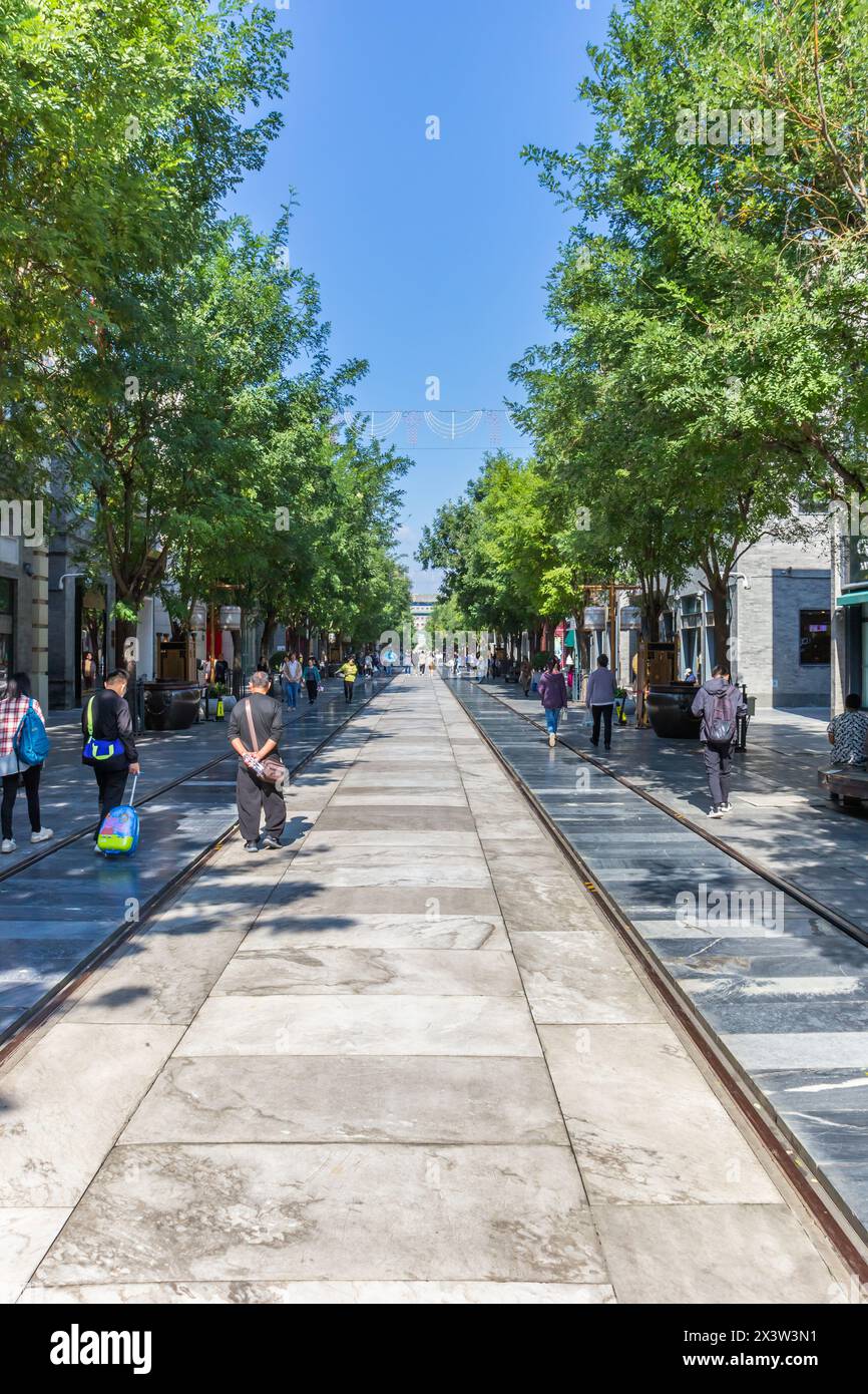 People walking the tree lined Qianmen street in Beijing, China Stock ...