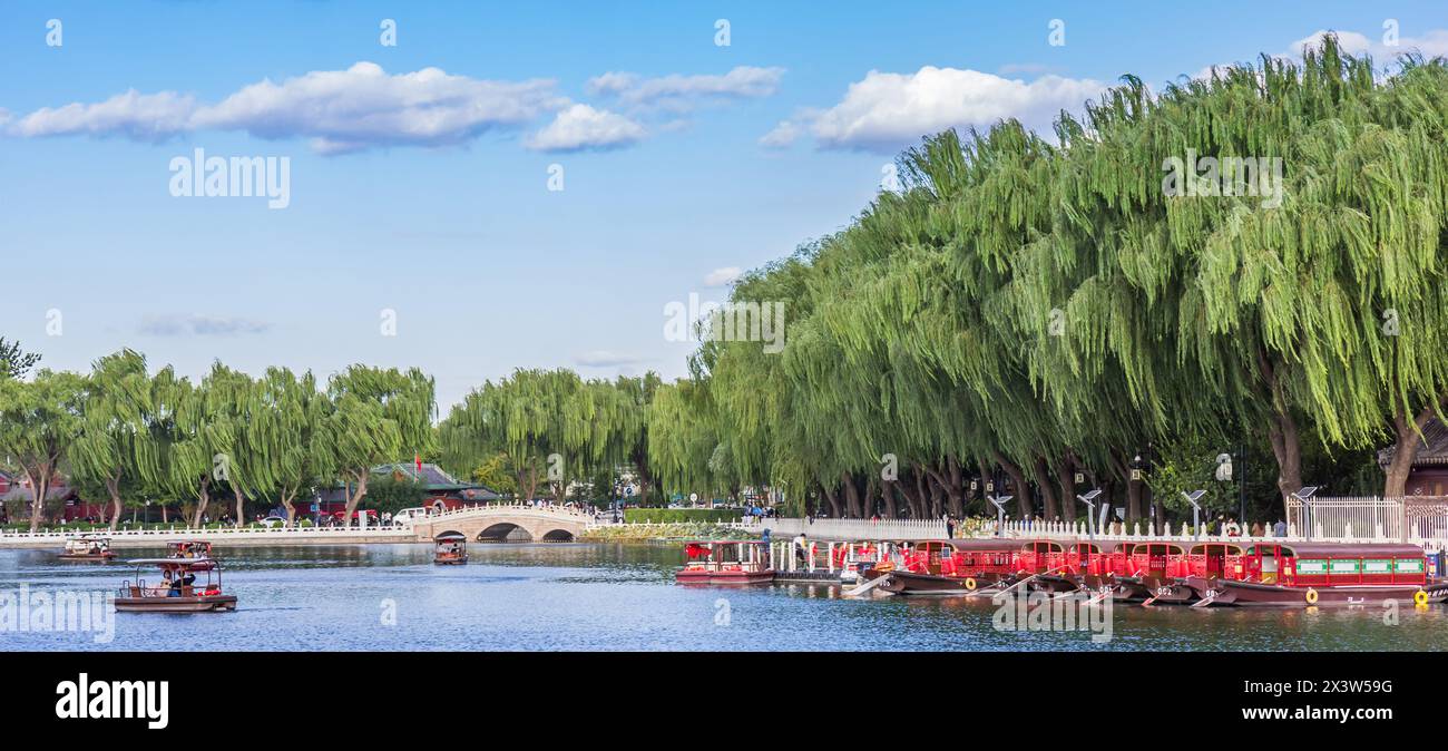 Panorama of willow trees and chinese boats at the Qianhai lake in ...
