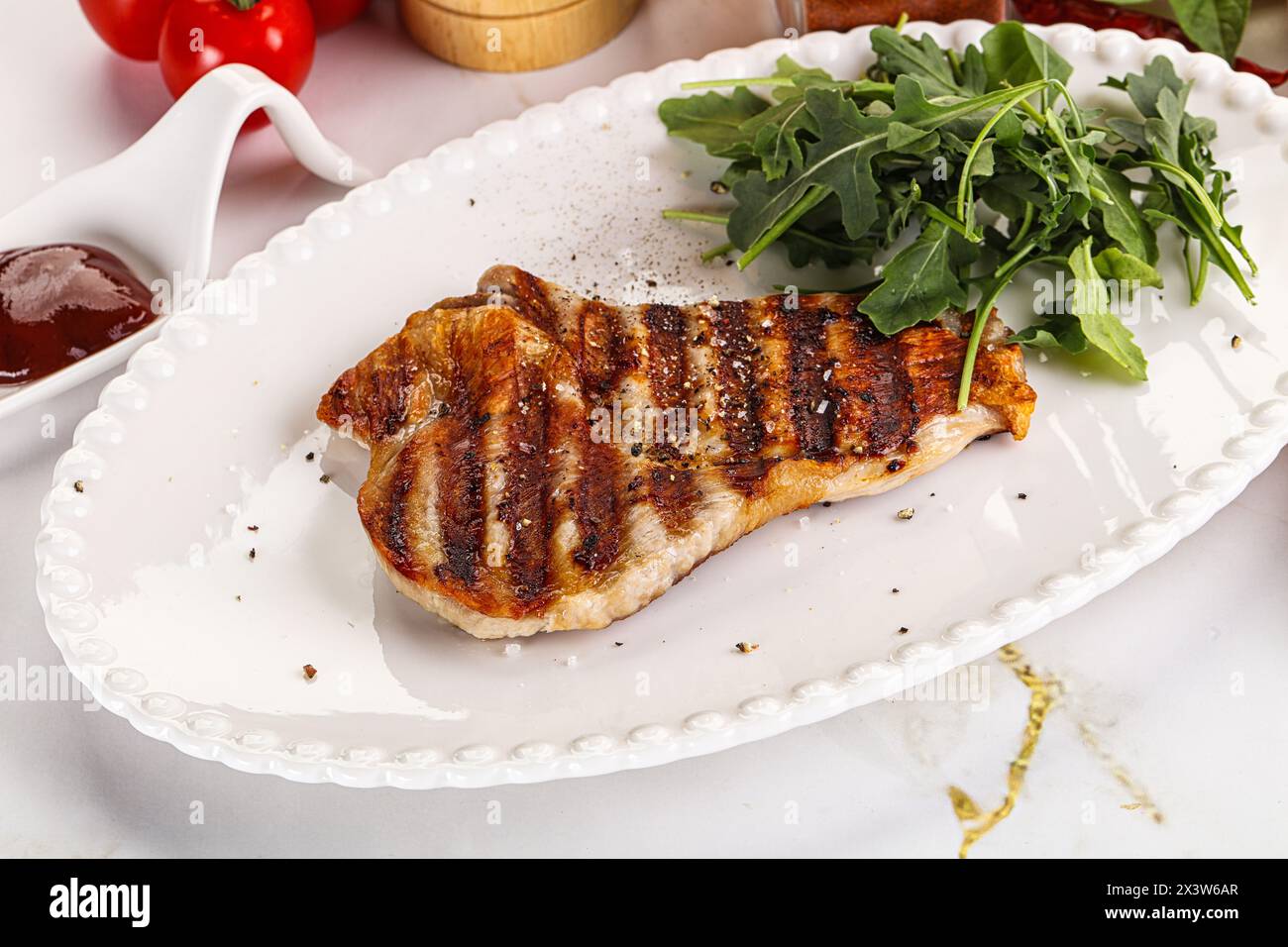Delicous grilled pork meat steak with sauce Stock Photo - Alamy