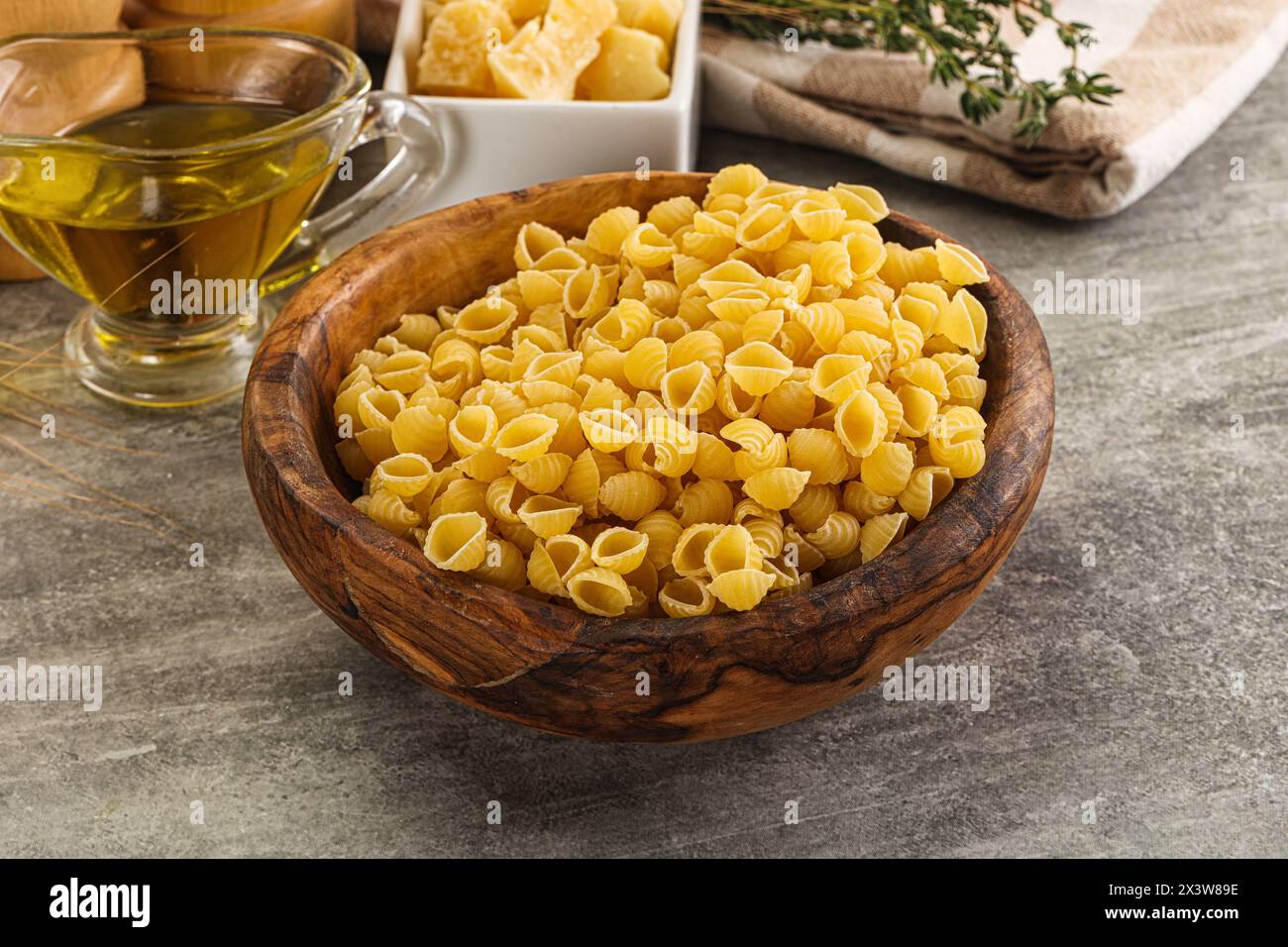 Italian cuisine - dry conchiglie shell pasta Stock Photo - Alamy