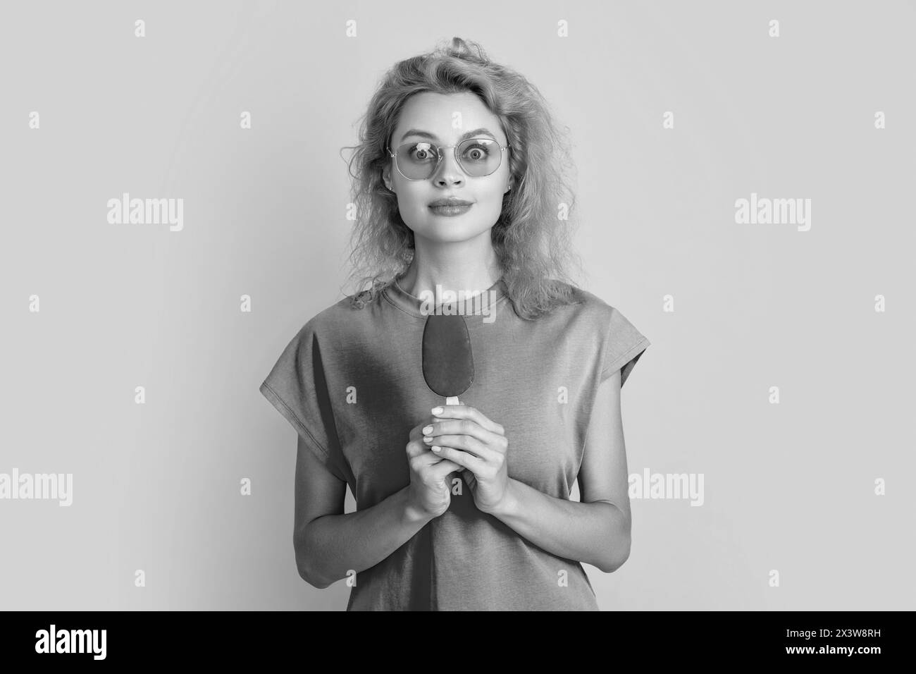 amazed woman with icelolly ice cream isolated on yellow. woman with ...