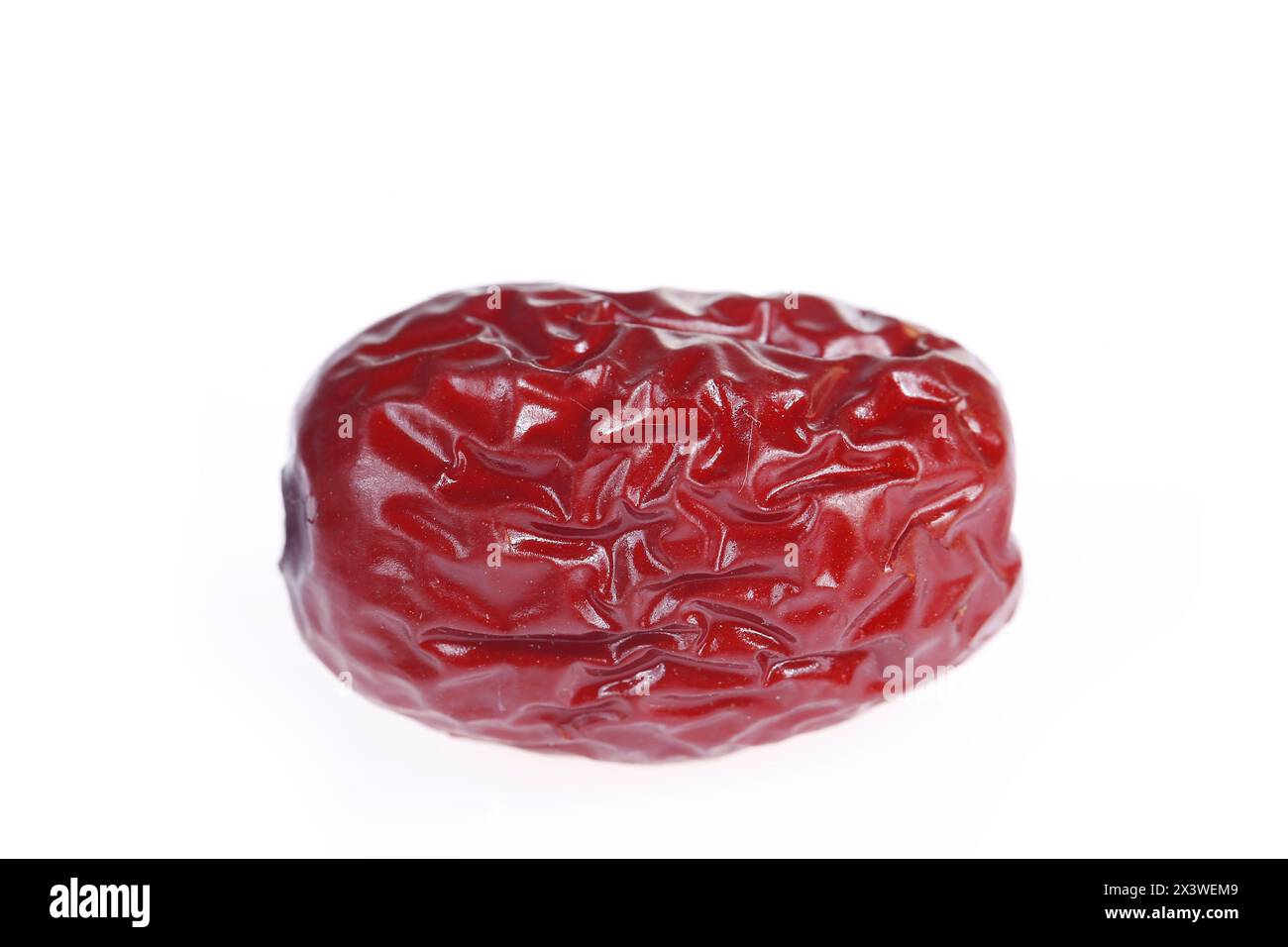 Red dates isolated on a white background, shot up close Stock Photo - Alamy