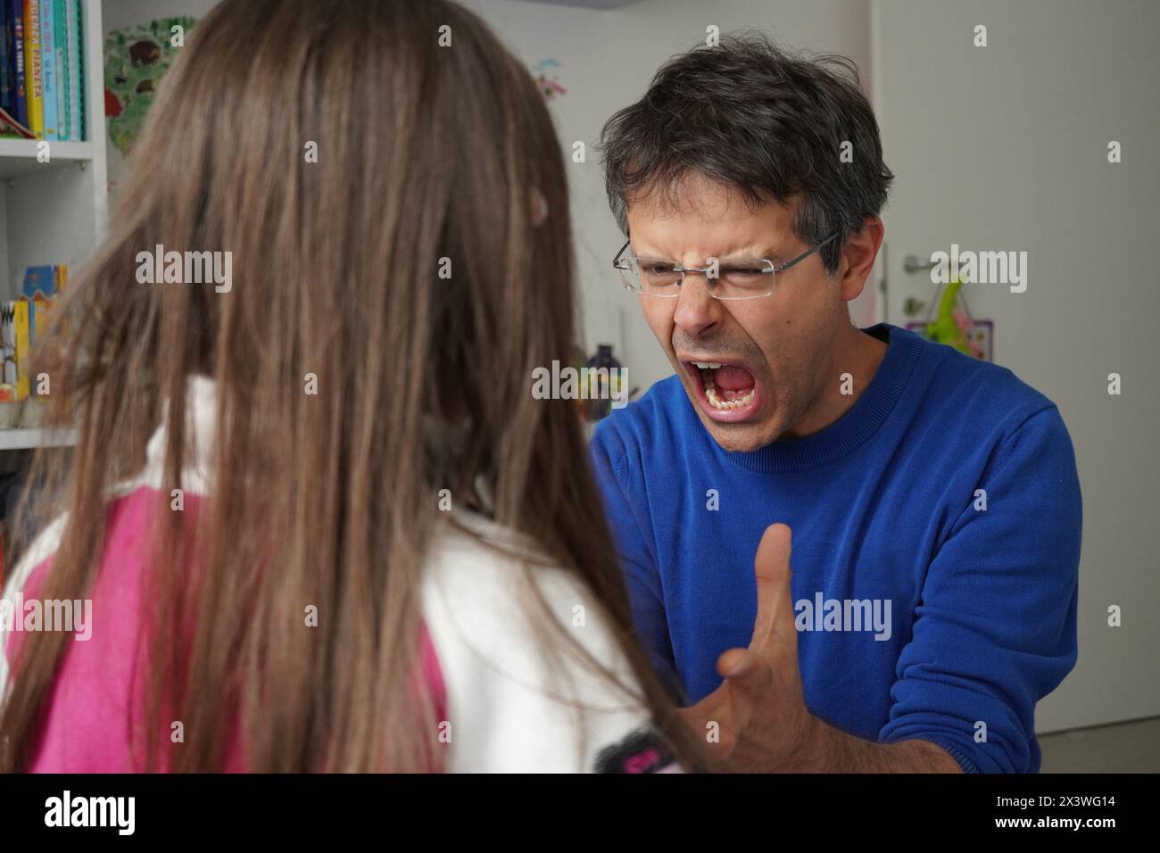 Nervous father aggressively scolds his six years old mortified daughter ...