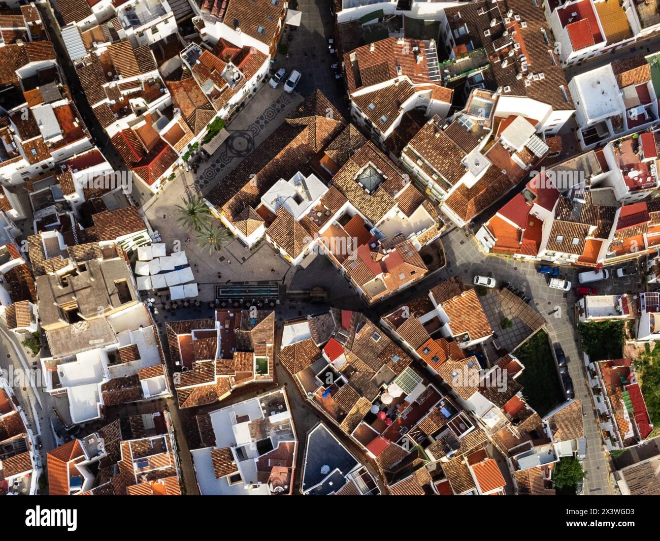 Overhead view of the curved streets and rooftops in Ojen, revealing the ...