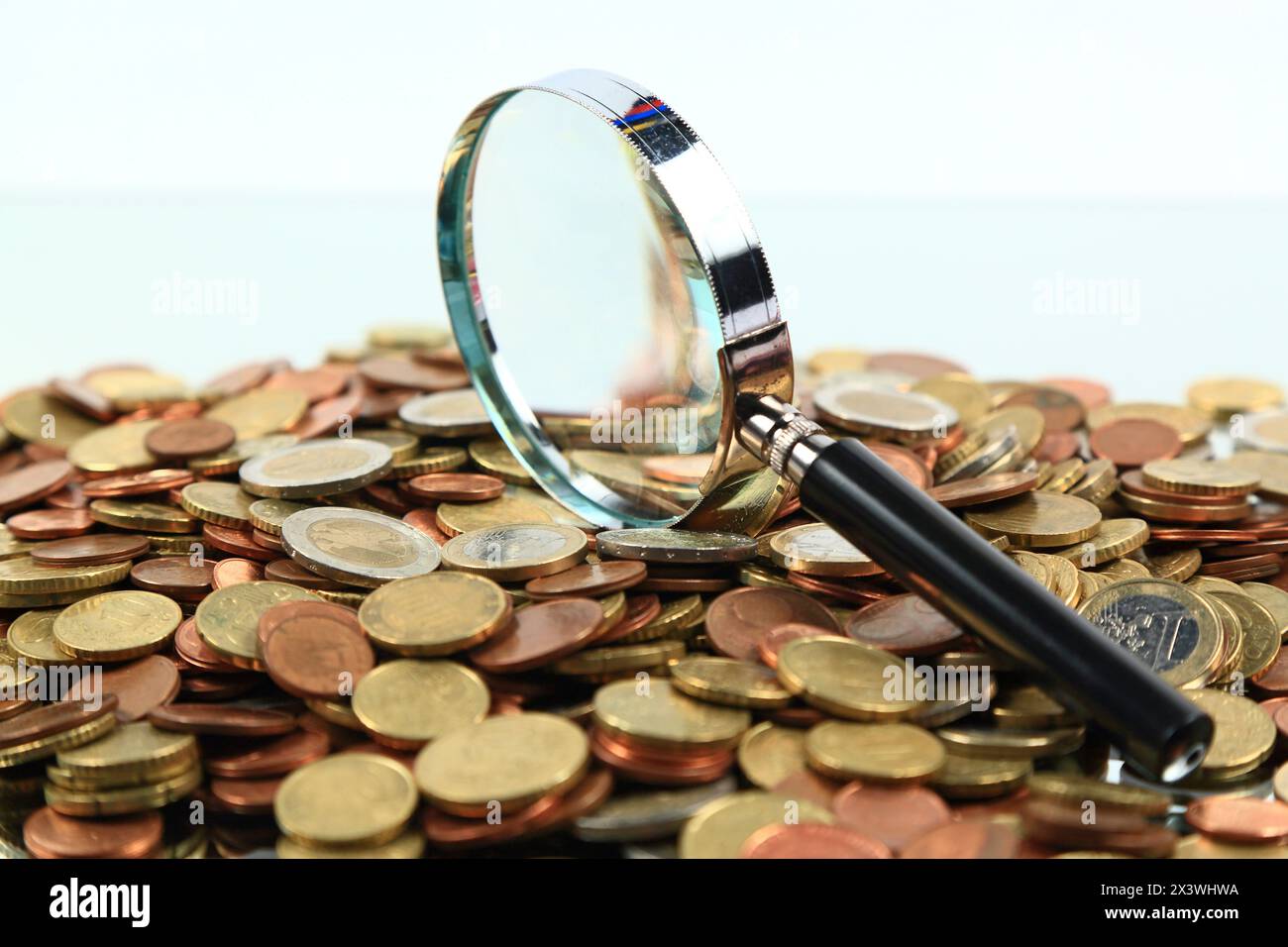 Still life on the theme of coins Stock Photo - Alamy