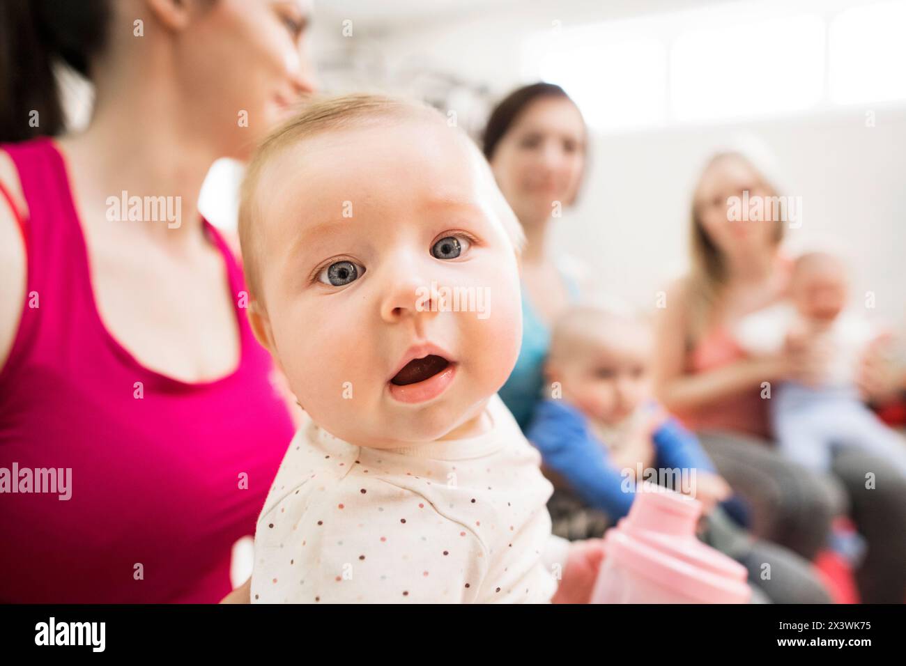 Baby movement class. Parents helping babies to improve motor skills ...