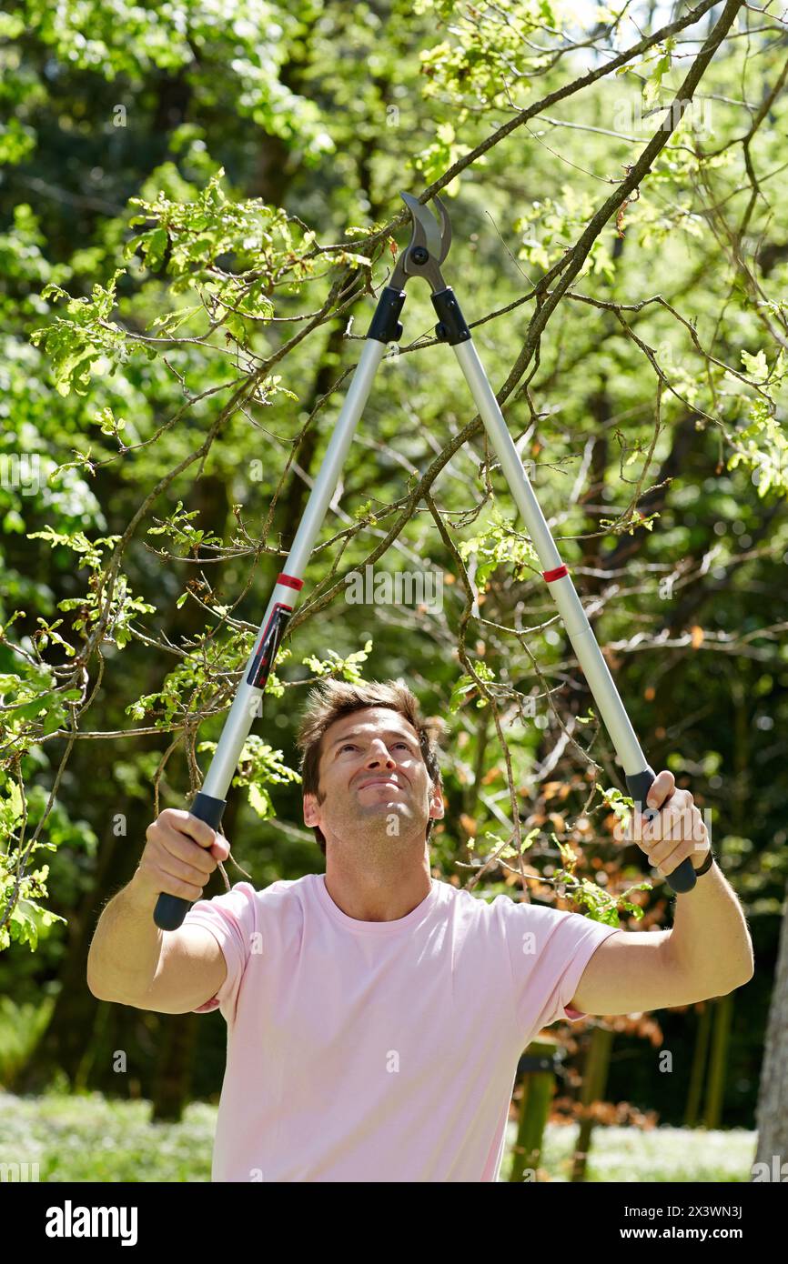 Cutting branch using secateurs hi-res stock photography and images - Alamy