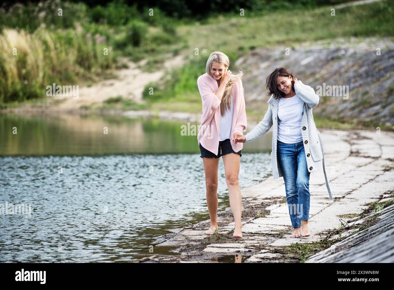 Adult daughter spending time with her mother. Mom and daughter outdoors ...