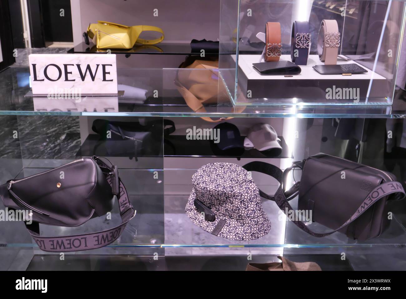 LOEWE HAT AND BAG ON DISPLAY INSIDE THE FASHION STORE Stock Photo - Alamy