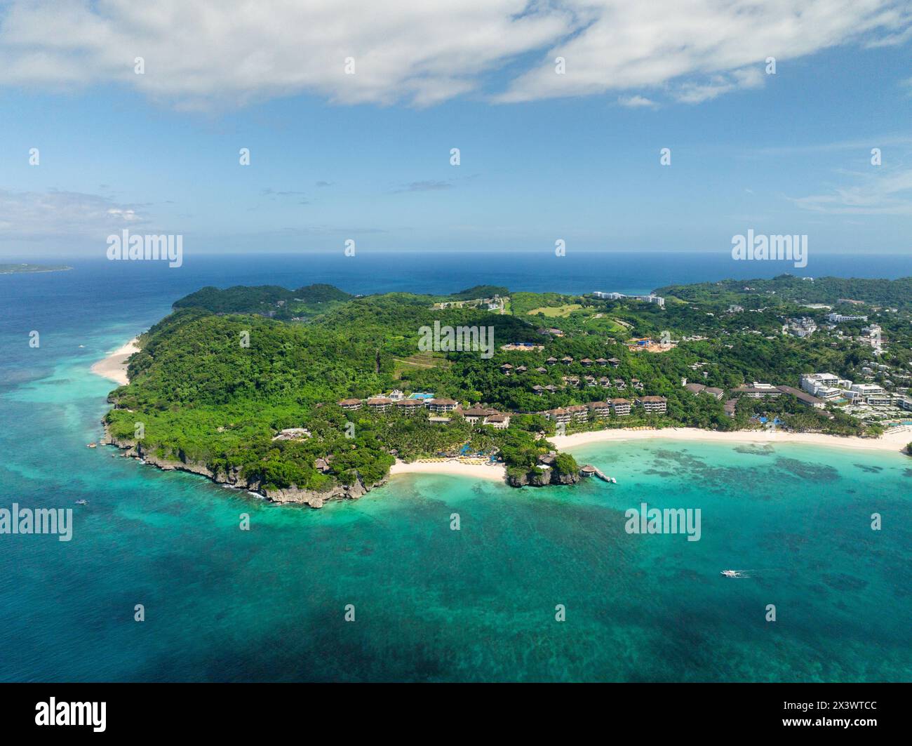 Beach resorts with white sands and tourist boat running over ...
