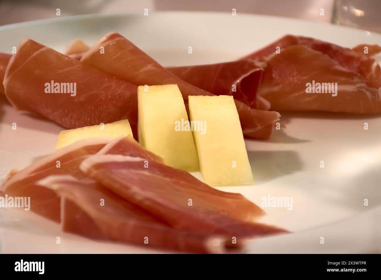 Ration of melon with cured ham typical of Spain Stock Photo - Alamy