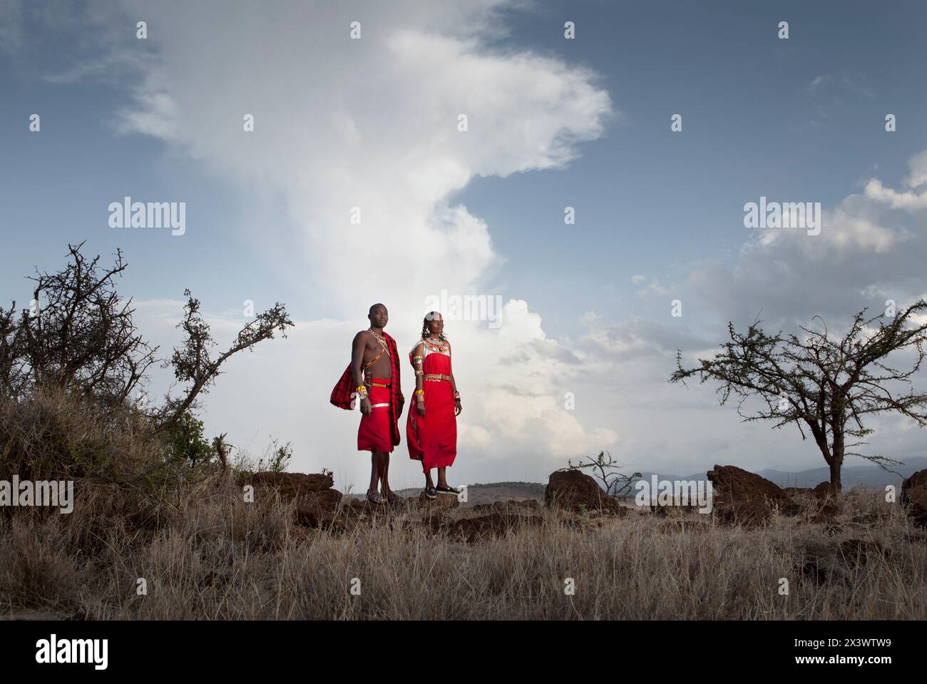 A Maasai safari guide couple from the Sirikoi Lodge stand for a ...