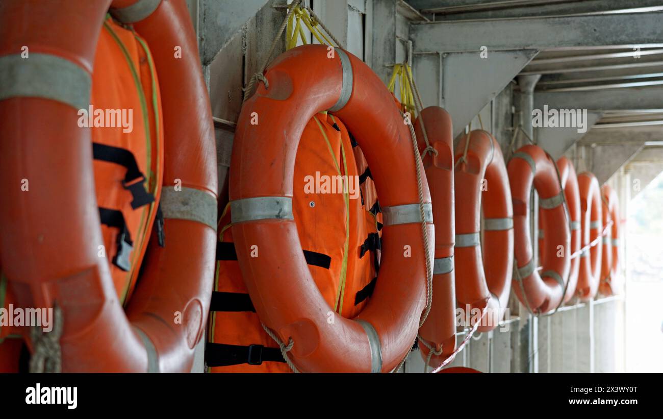 orange rescue rings on a boat in cambodia Stock Photo - Alamy