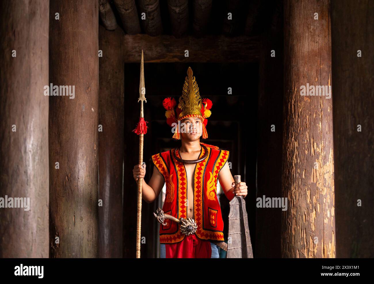 A traditional stone jumper, dressed in ceremonial attire, poses with a ...