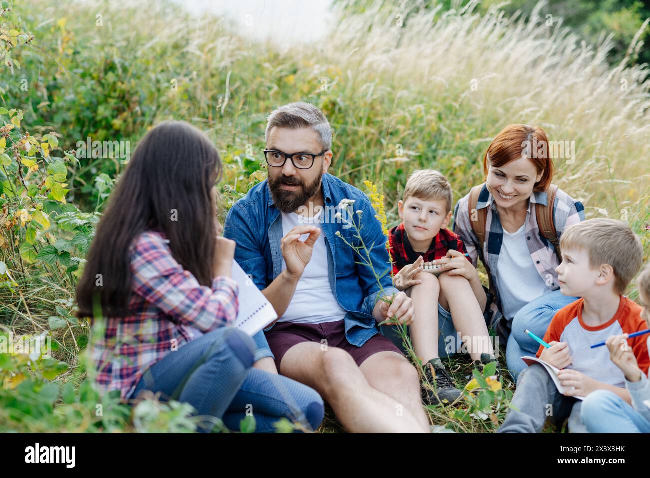 Young students learning about nature, forest ecosystem during biology ...