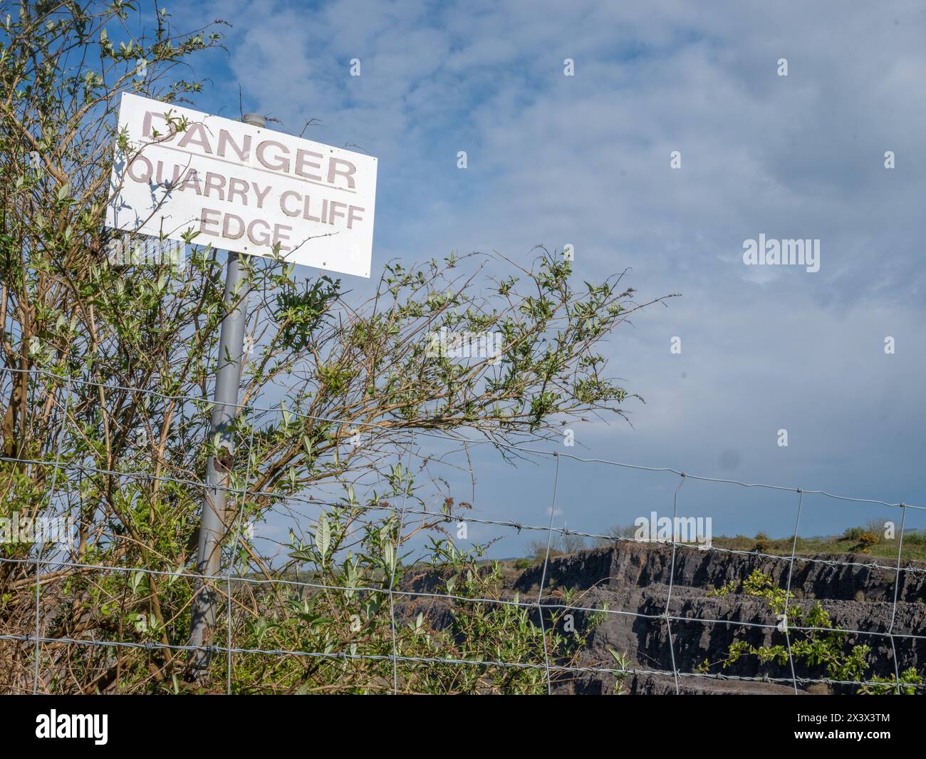 April 2024 - Danger quarry cliff edge sign and safety notices at the ...