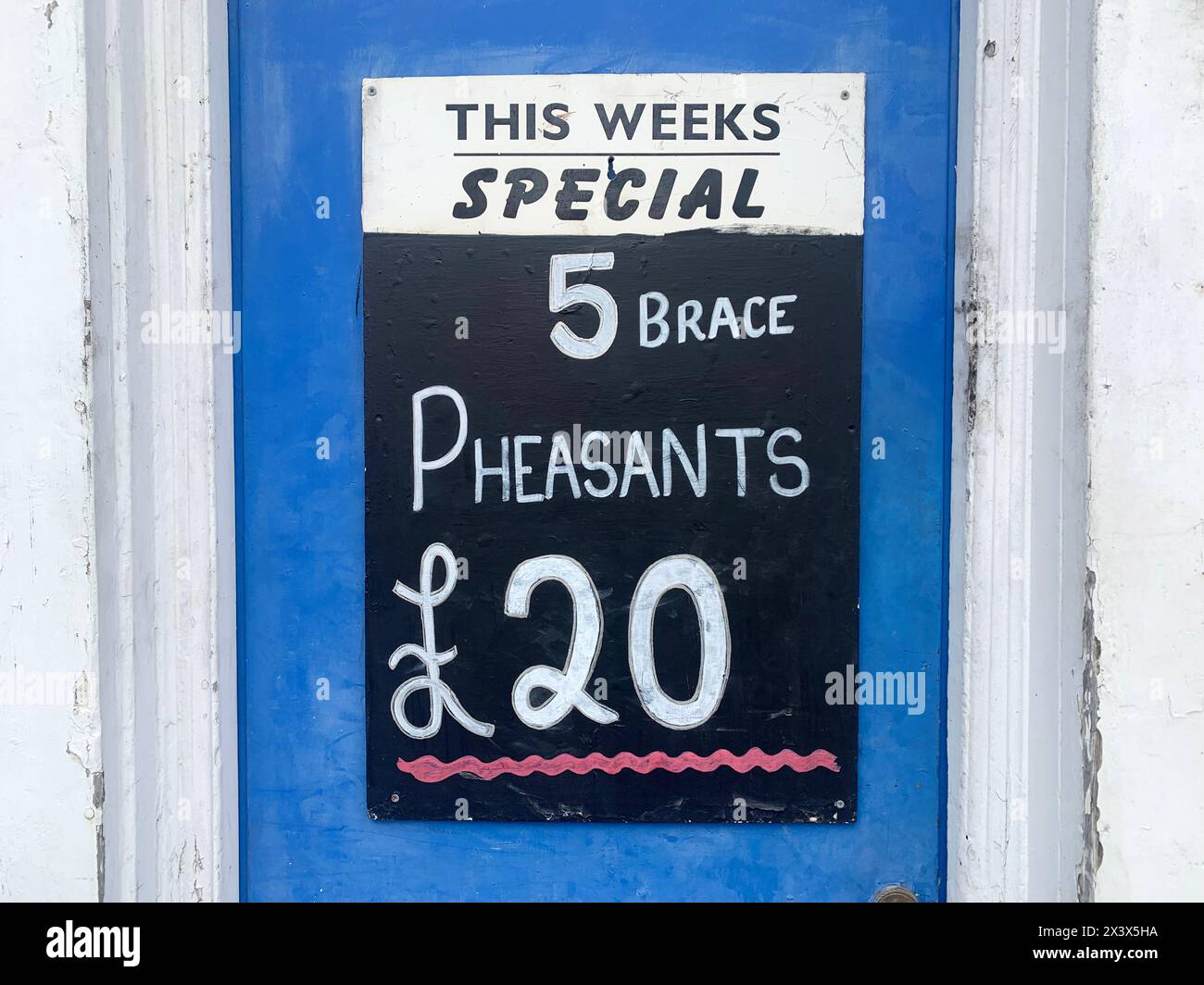 Signage indicating the price of Pheasants, outside a butchers shop in ...