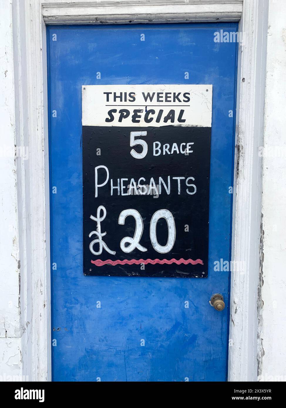 Signage indicating the price of Pheasants, outside a butchers shop in ...