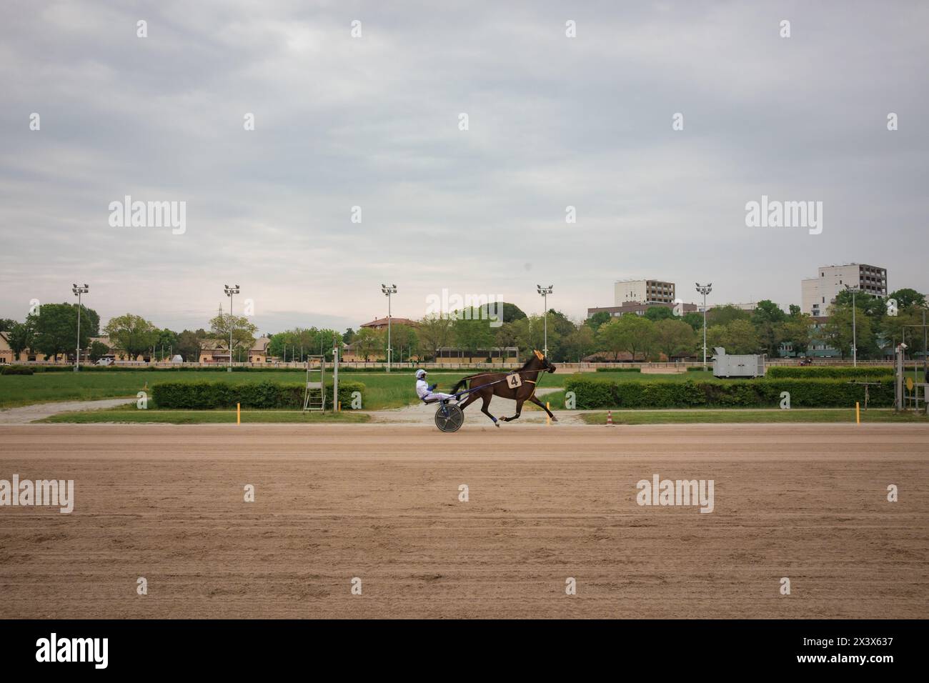 A jockey and his horse race on the Hippodrome track Stock Photo - Alamy