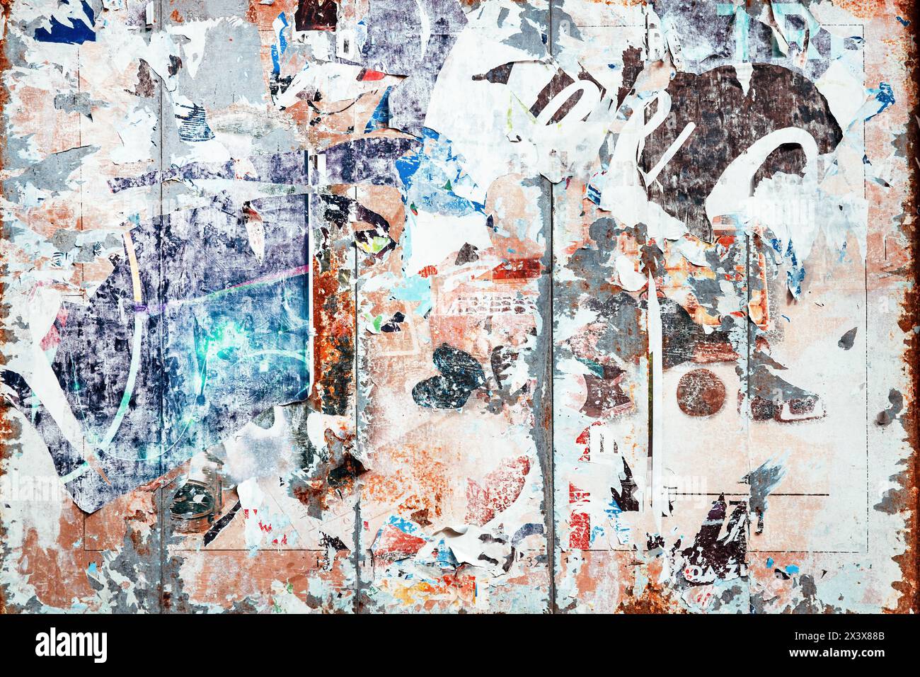 Texture of torn poster paper on a billboard as grunge background and ...