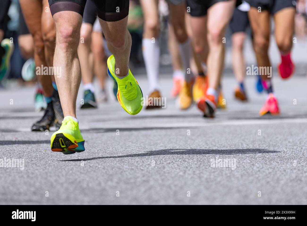legs of a group of runners at the hamburg marathon Stock Photo - Alamy