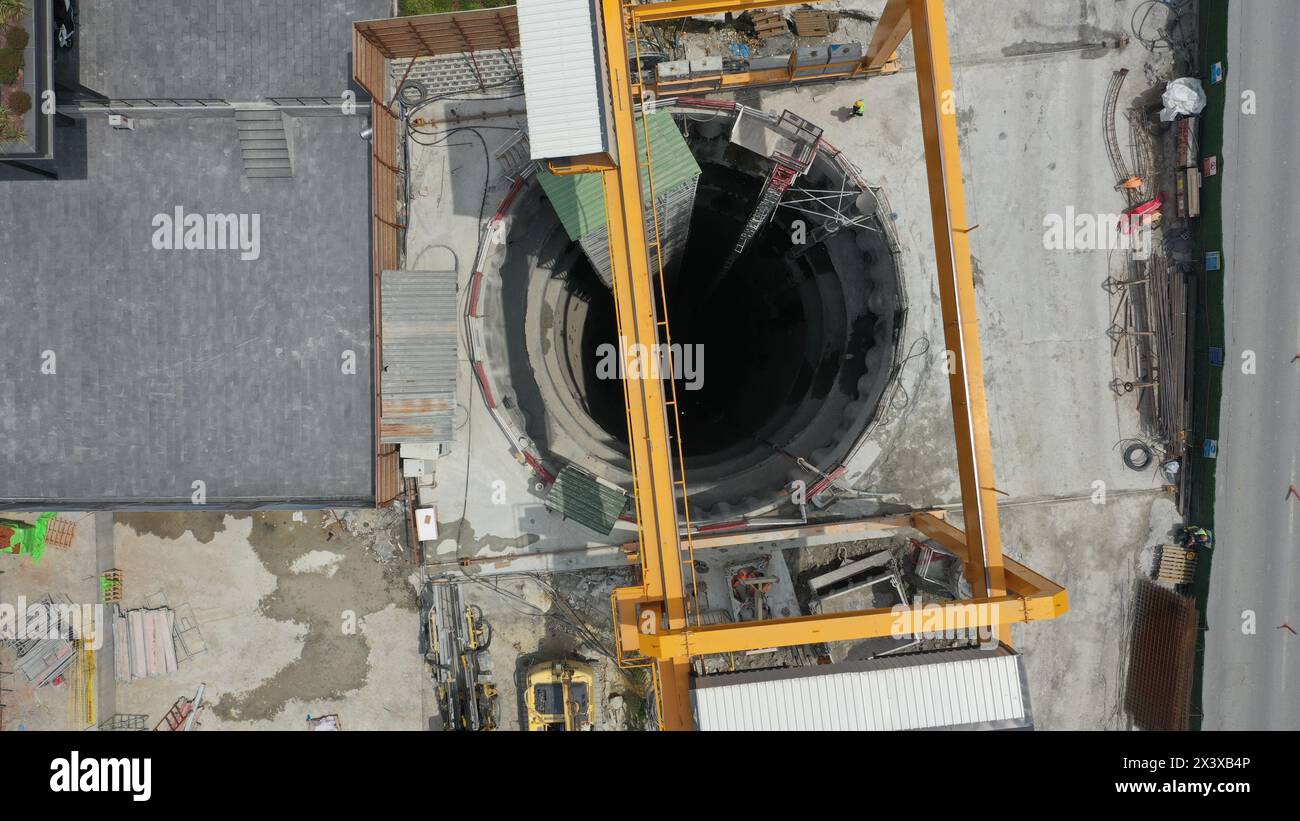 Iron climbing ladder, loader, construction equipment inside the deep ...