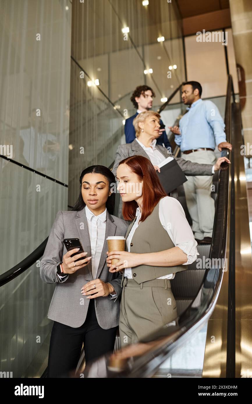 Diverse group of business people standing on escalator, moving upwards ...