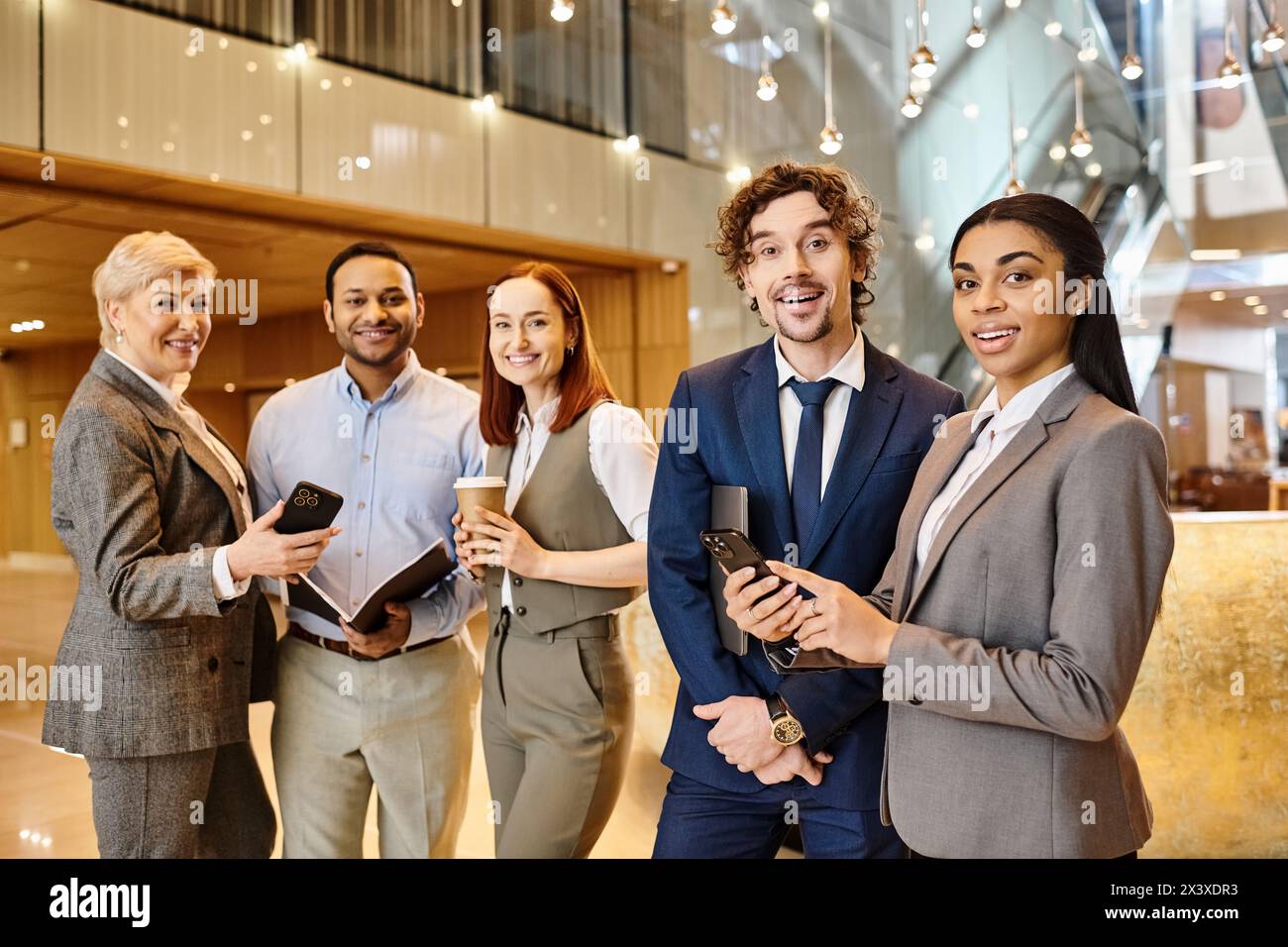 A diverse group of business people standing in a circle, discussing ...