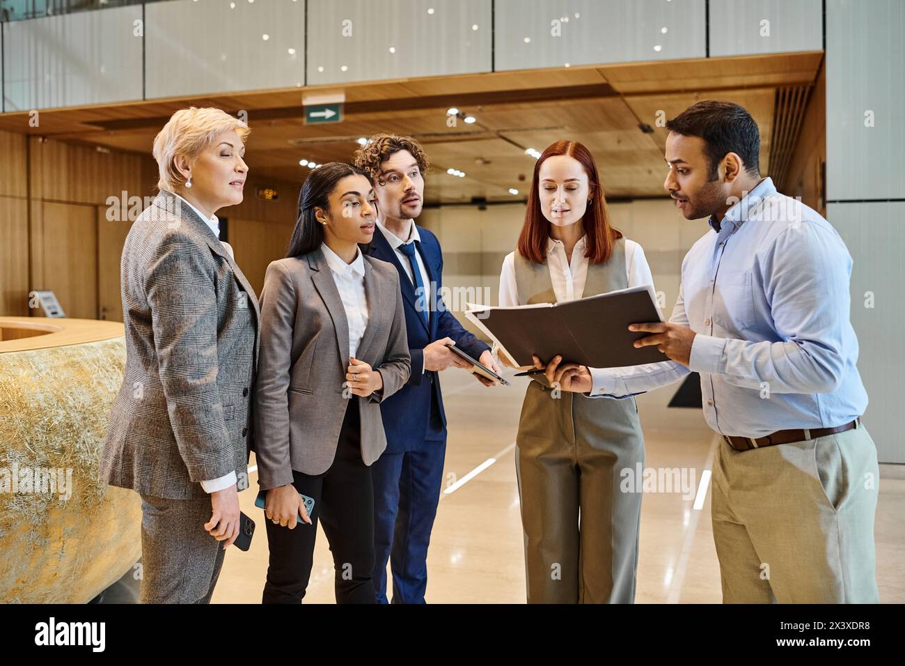 A diverse group of business people collaborating and strategizing ...