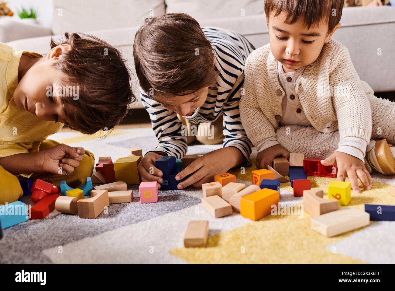 Three young children, likely siblings, engage in imaginative play as ...
