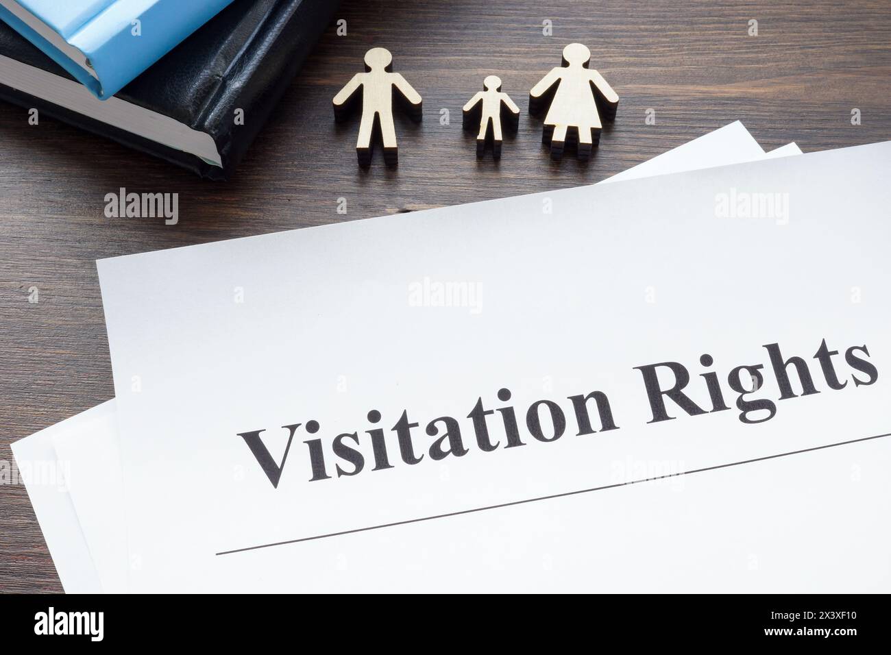 Visitation rights documents, books and family figures Stock Photo - Alamy