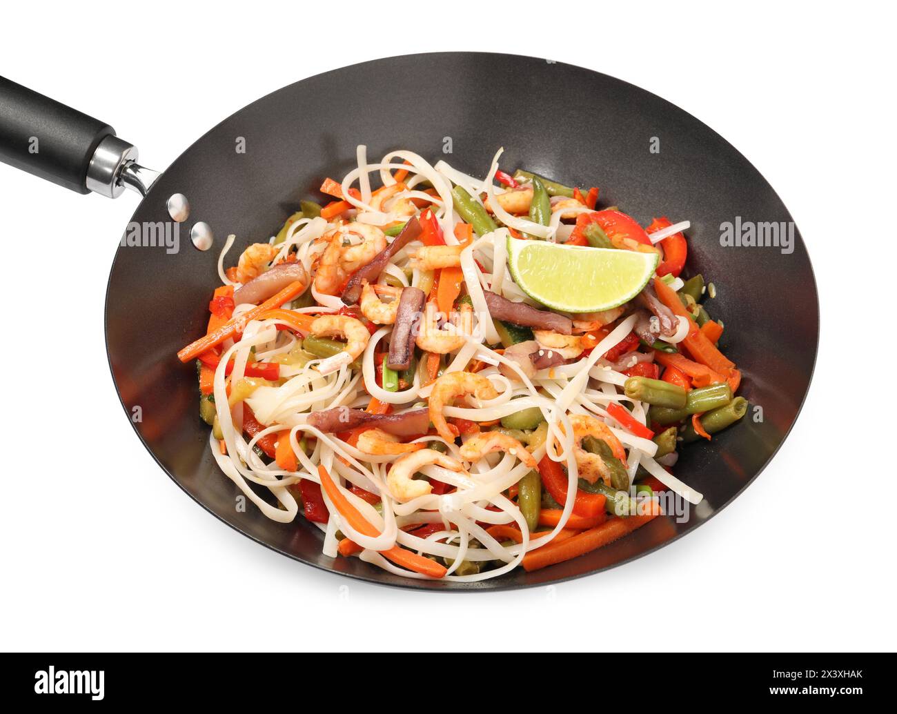 Shrimp stir fry with noodles and vegetables in wok isolated on white ...