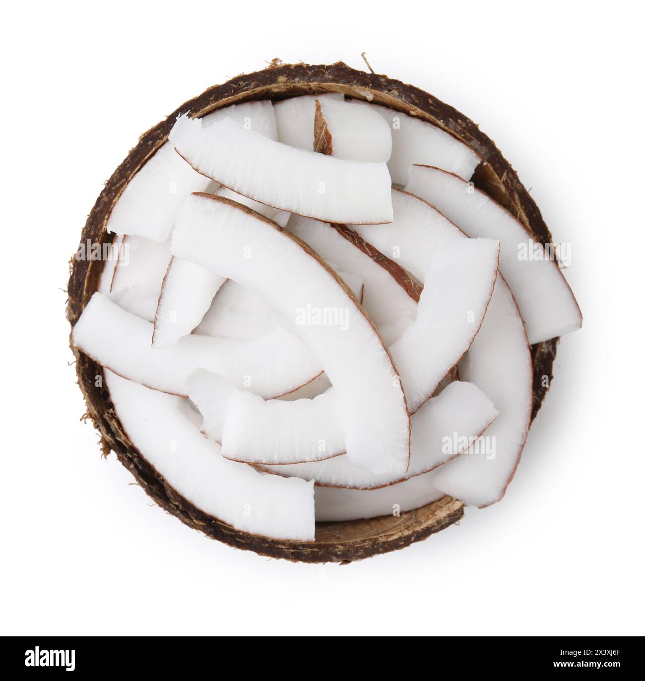 Fresh coconut pieces in nut shell isolated on white, top view Stock ...