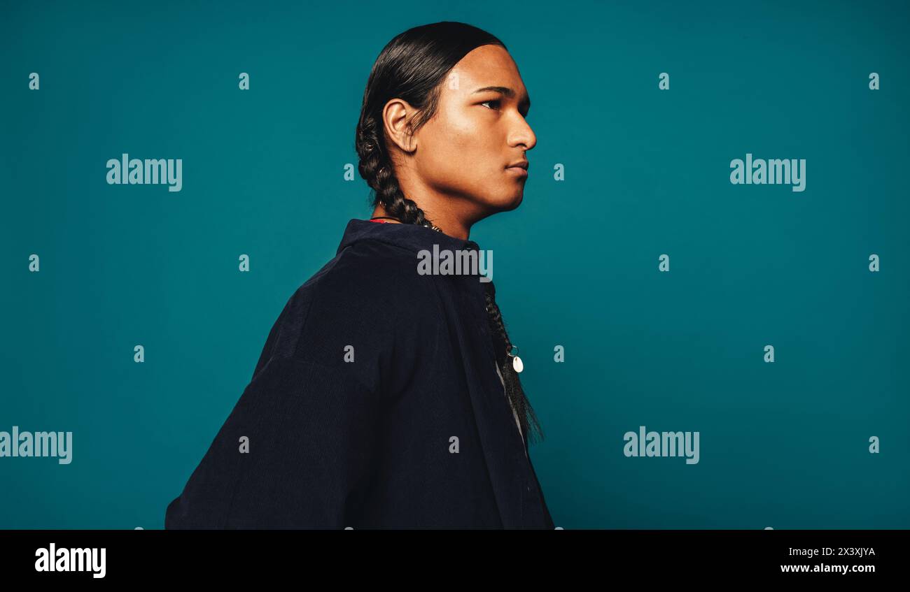 Native man exudes confidence, standing casually with long braided hair ...