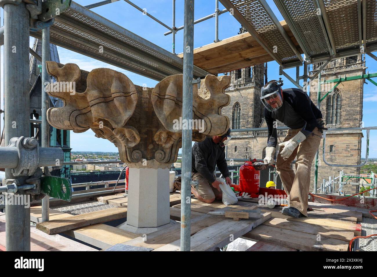 Magdeburg, Germany. 29th Apr, 2024. Stonemasons Markus Funke (l) and ...