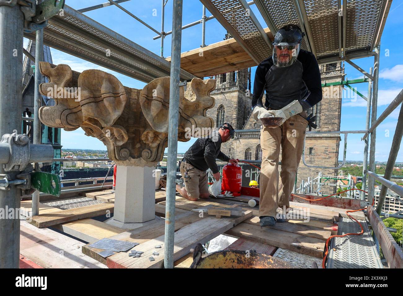 Magdeburg, Germany. 29th Apr, 2024. Stonemasons Markus Funke (l) and ...