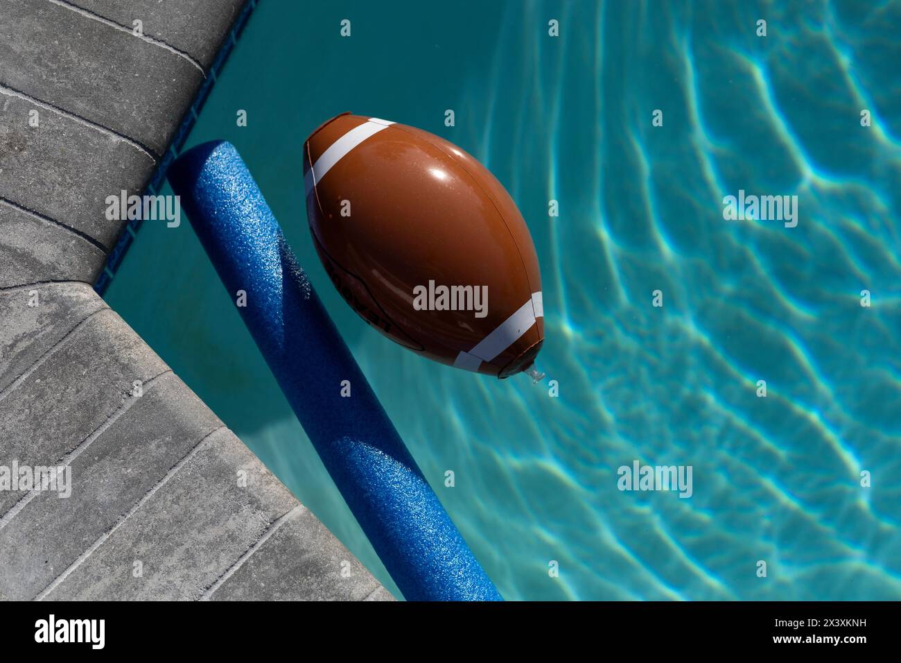 inflatable ball floating in the pool Stock Photo - Alamy