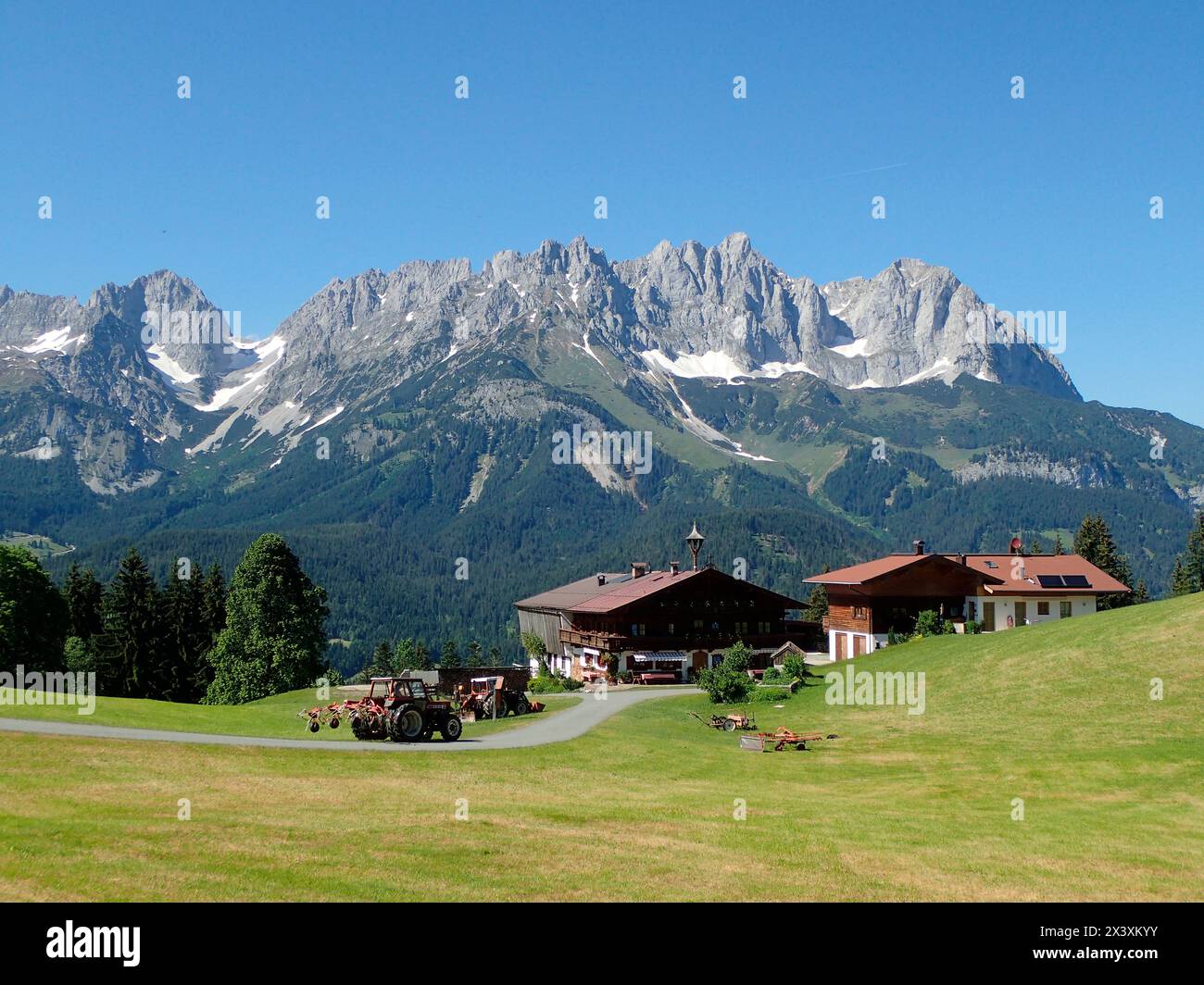 Austria, Tyrol, Kitzbuhel, traditional farm at Holenauerkreuz in front ...