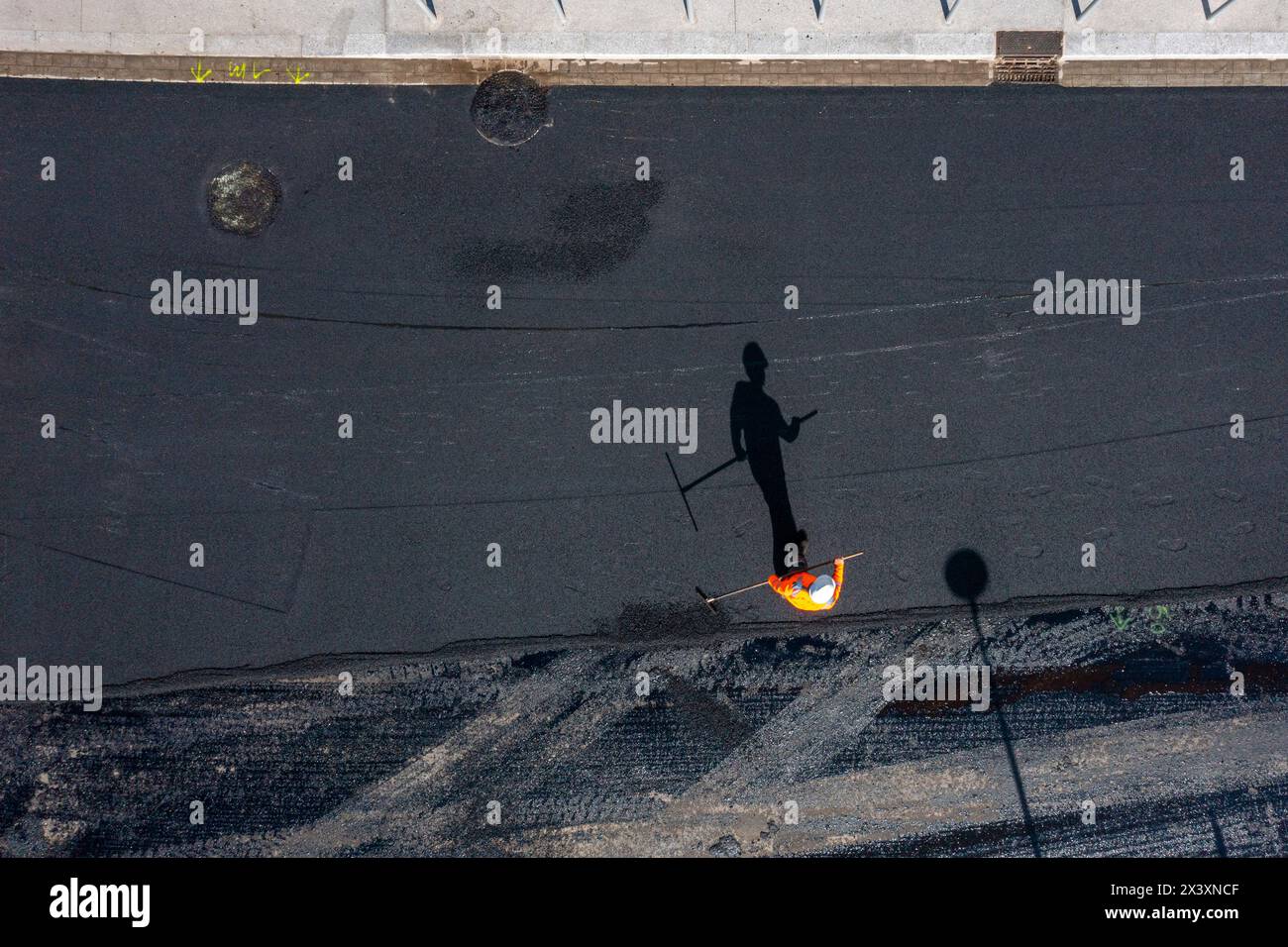 Bitumen, laying of asphalt on a road Stock Photo - Alamy