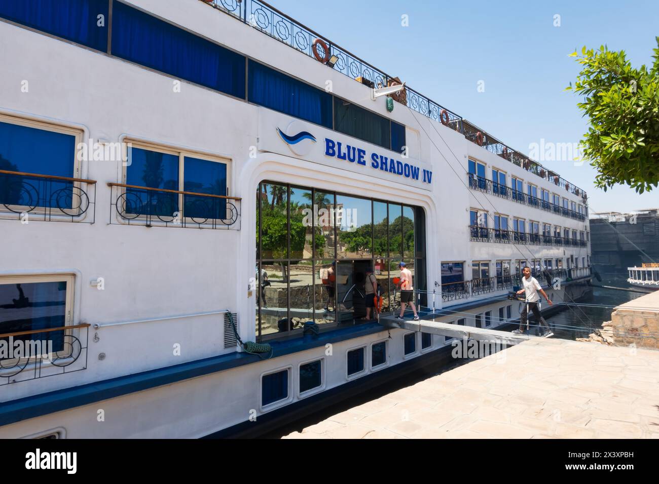 Tourist passengers embark on the Nile cruise ship, Blue Shadow IV ...