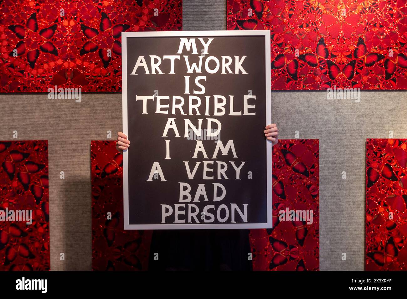 London, UK. 29 April 2024. A staff member with 'My Artwork is Terrible ...