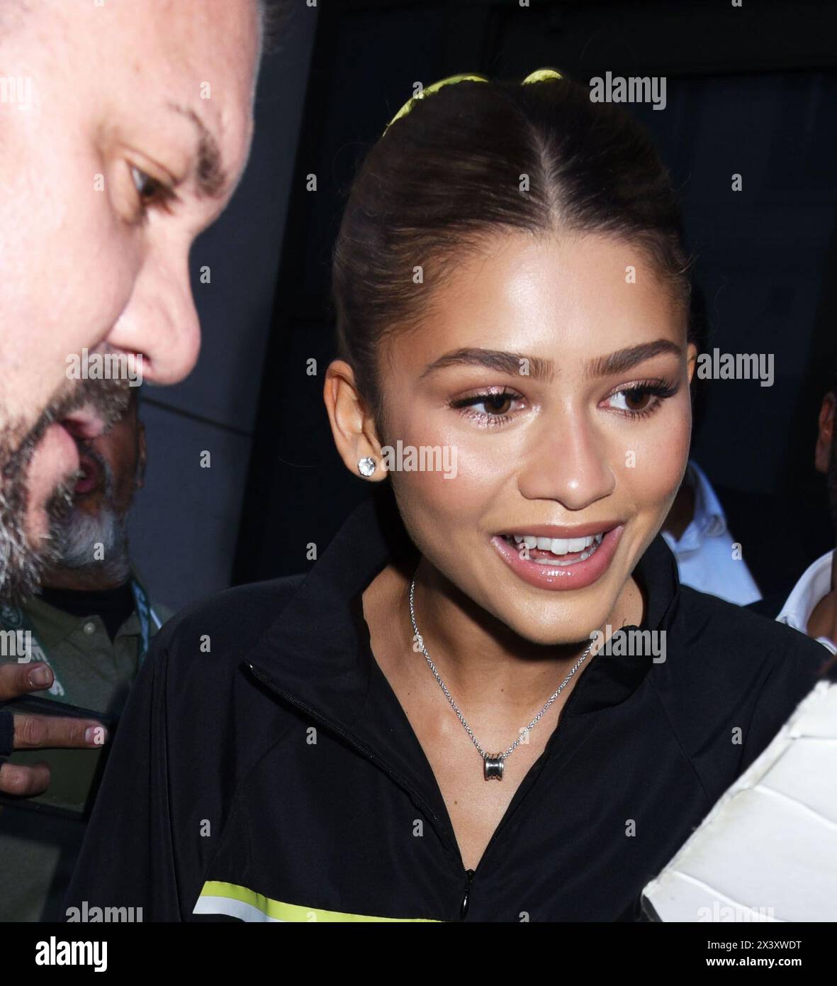 Zendaya signs and poses for fans as she leaves her hotel to go to a ...